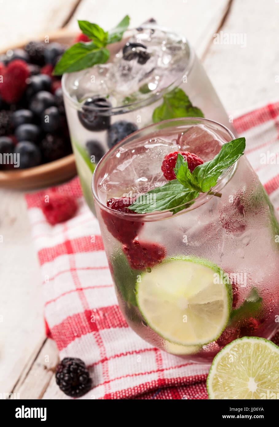 Summer cold drinks with raspberries, blueberries and blackberrries on ...
