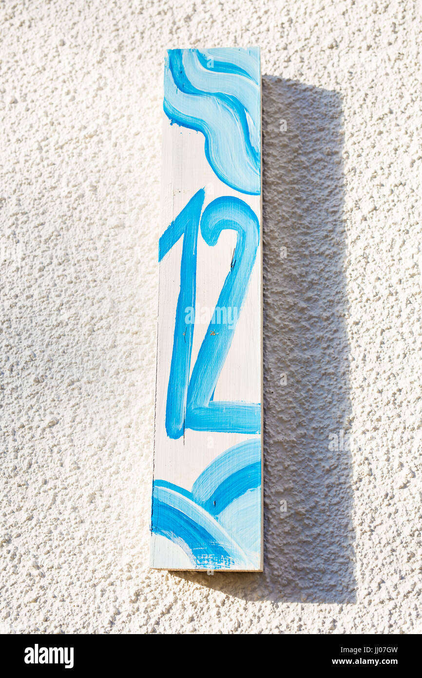 Number twelve 12 painted on wooden signboard Stock Photo - Alamy