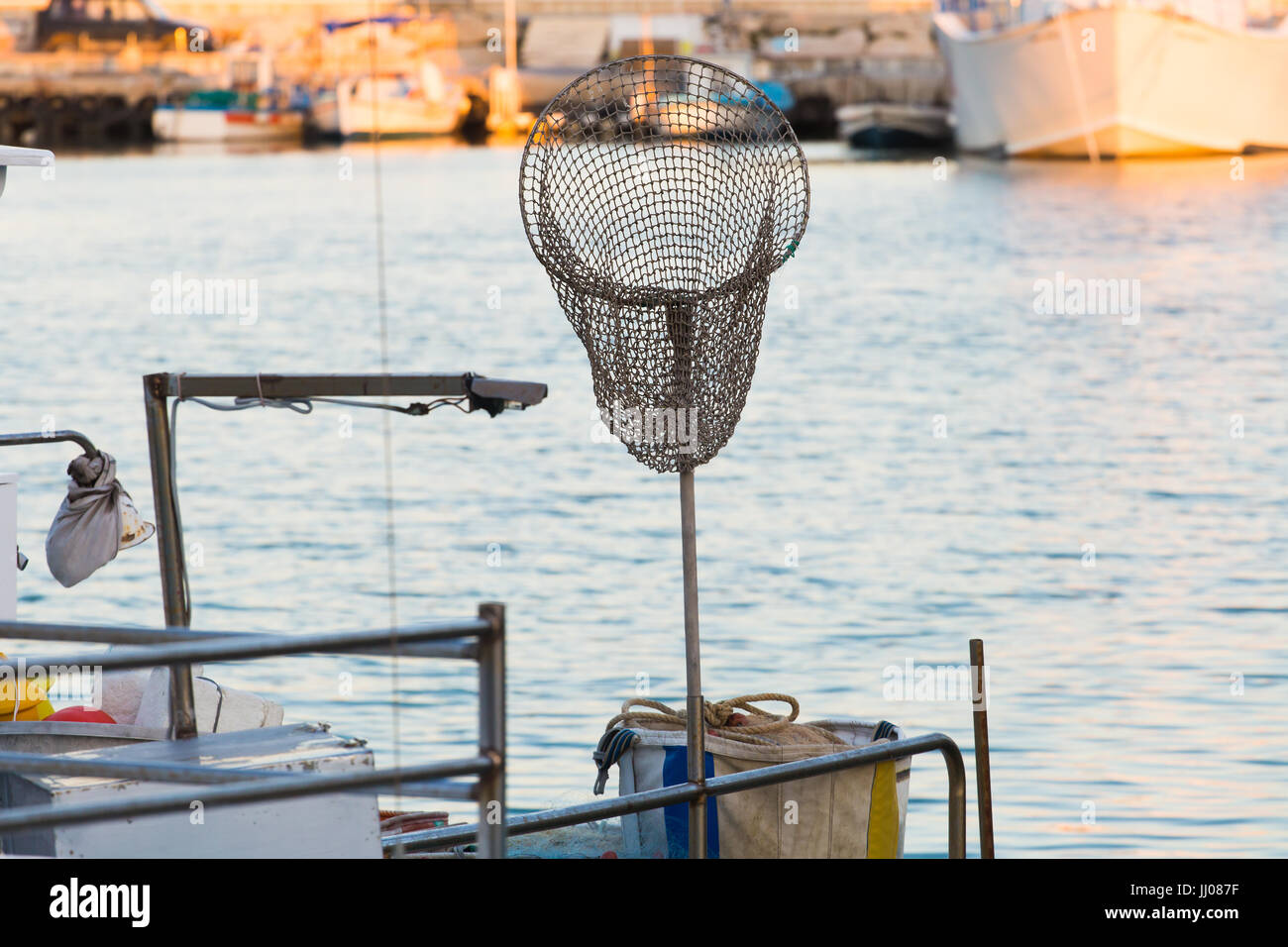 dip net in boat fishing Stock Photo - Alamy