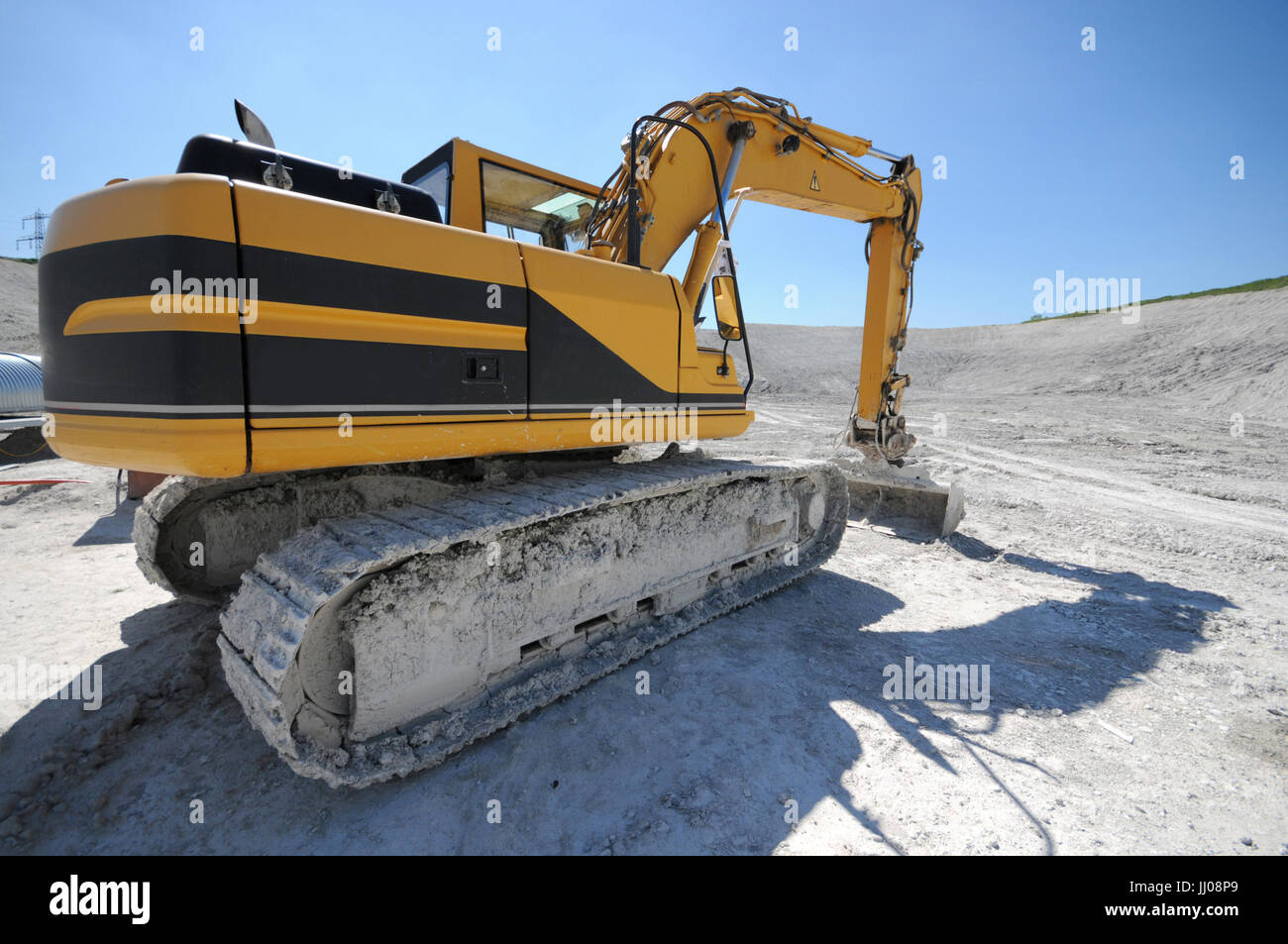 Excavator and Equipment in a chalk quarry. mining industry Stock Photo ...