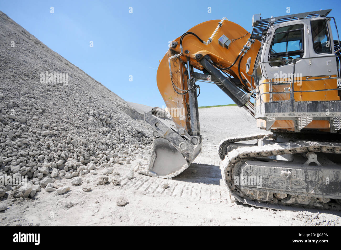 Excavator and Equipment in a chalk quarry. mining industry Stock Photo ...