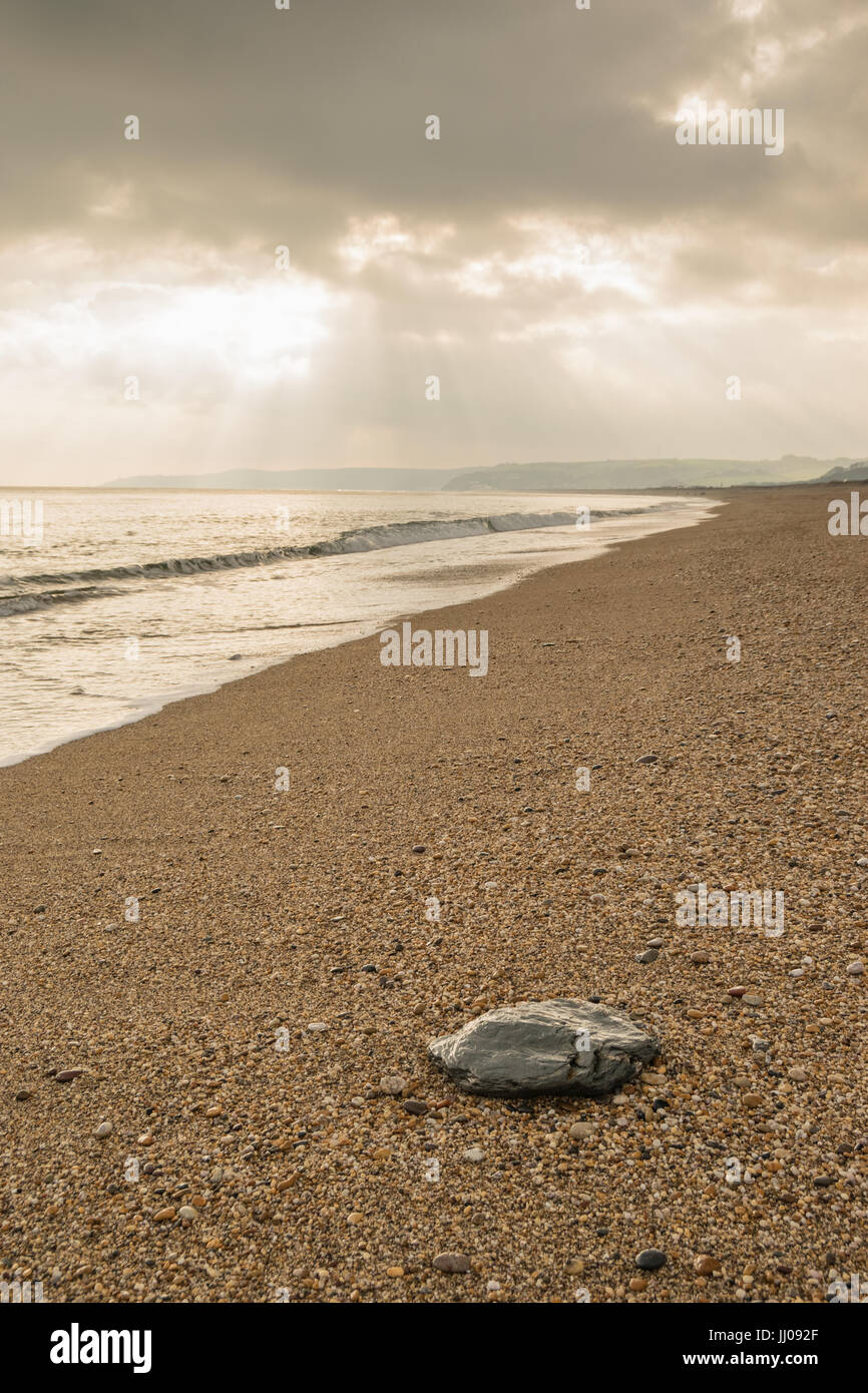 Single stone in the surf Stock Photo - Alamy