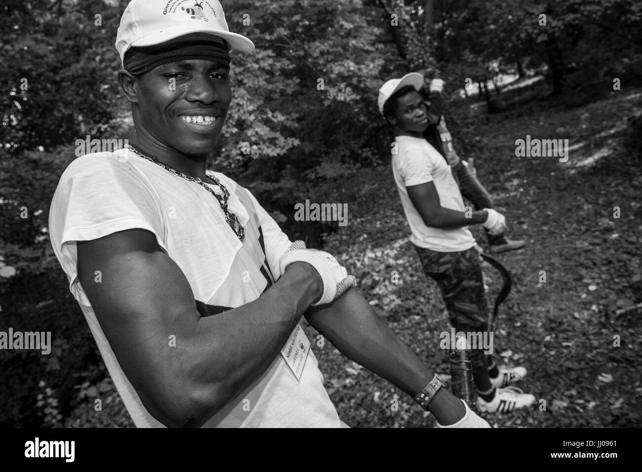 Italy, Mortara, Forest maintenance by migrant boys Stock Photo - Alamy