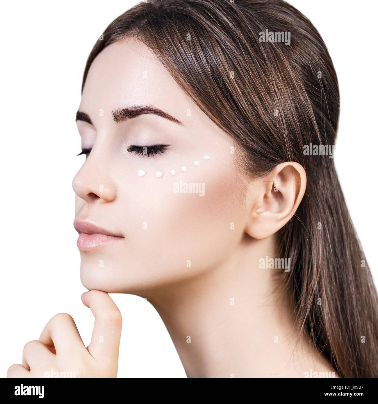 Young sensual woman with cream dots on face Stock Photo - Alamy