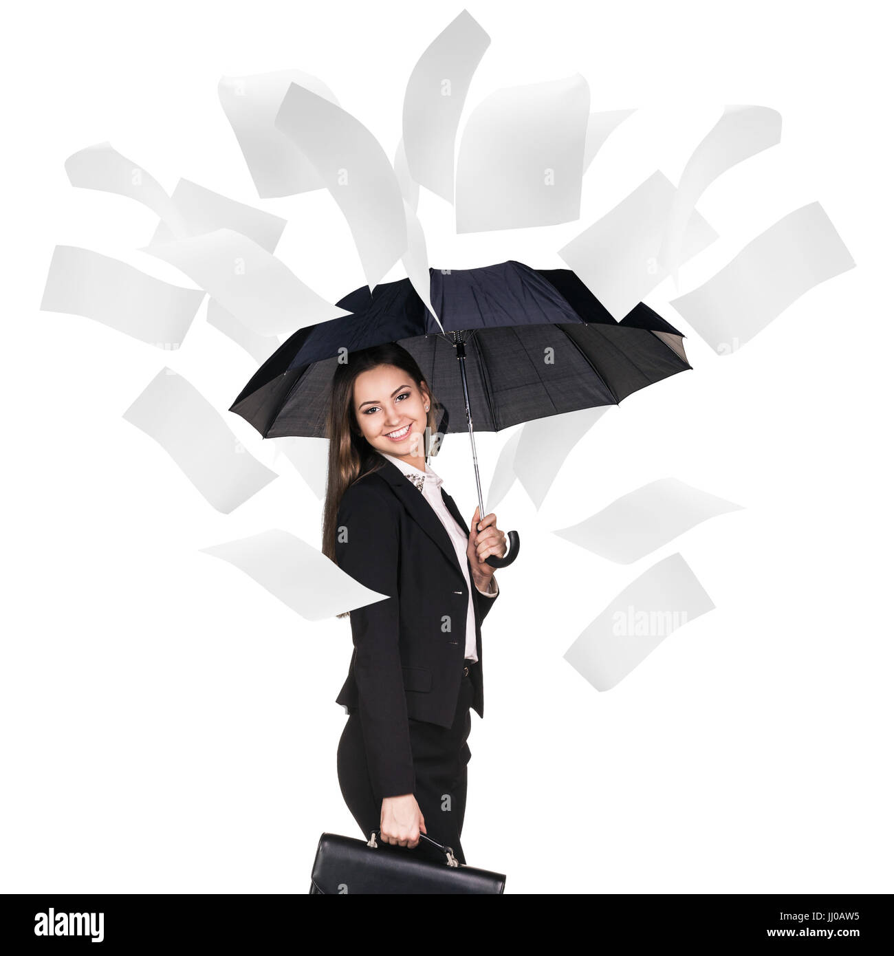 Young business woman under falling pages Stock Photo - Alamy