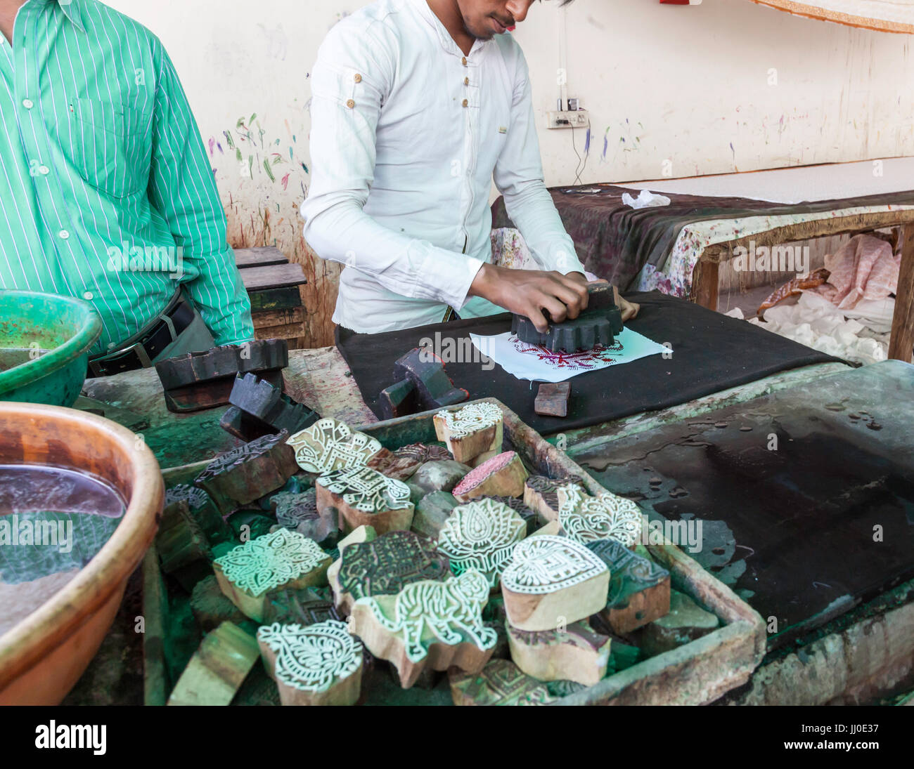 Man in India,New Delhi is stamping patterns on fabric in Factory in ...