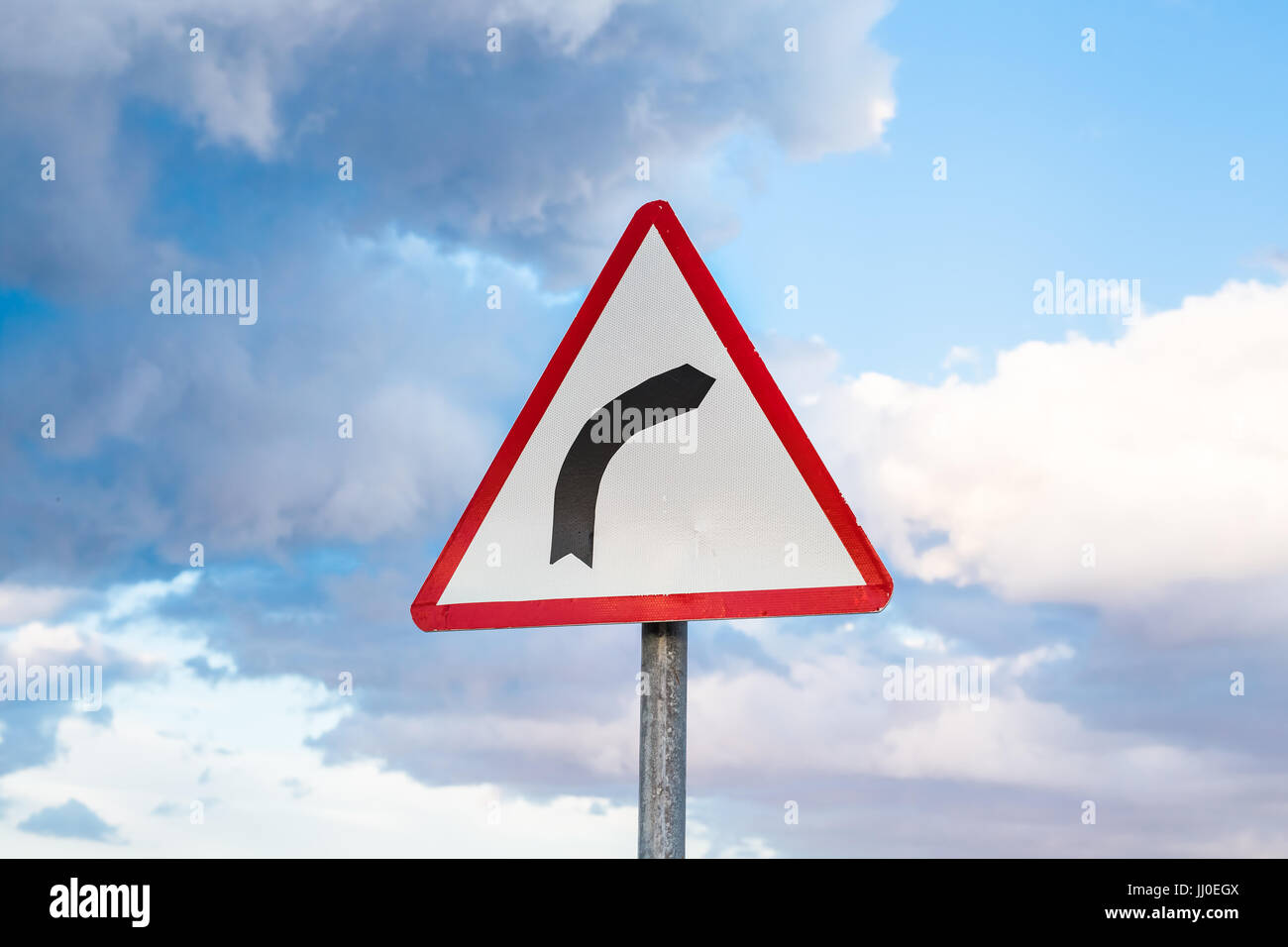 Traffic Sign dangerous, turn right Stock Photo - Alamy