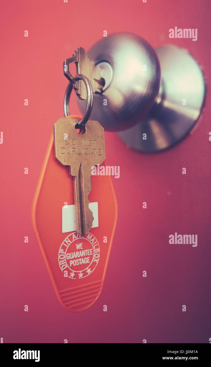 Vacation Detail Of A Retro Motel Room Key In The Door Handle Stock ...