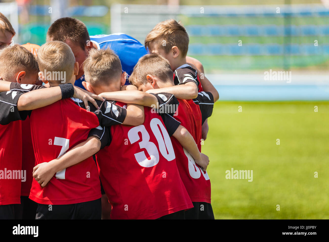Children sports soccer team. Kids standing together on the football ...