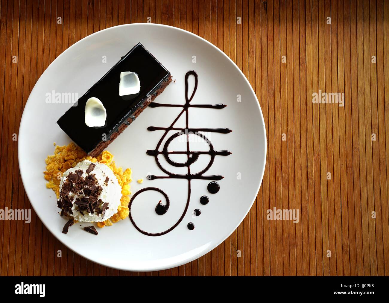 Delicious dark chocolate cake decorated with slice of white chocolate ...