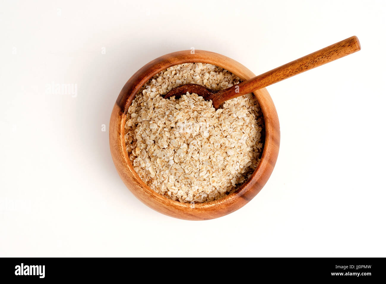 Oatmeal inside wooden bowl Stock Photo - Alamy