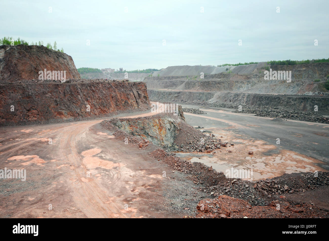 dirty road leadning through a quarry mine Stock Photo - Alamy