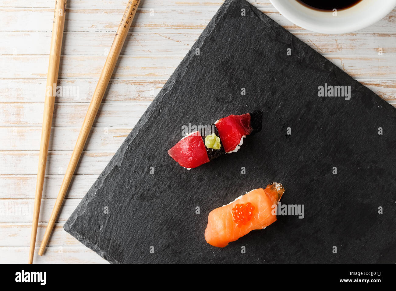 Salmon Nigiri with Salmon Roe and red tuna with wasabi paste Nigiri on ...