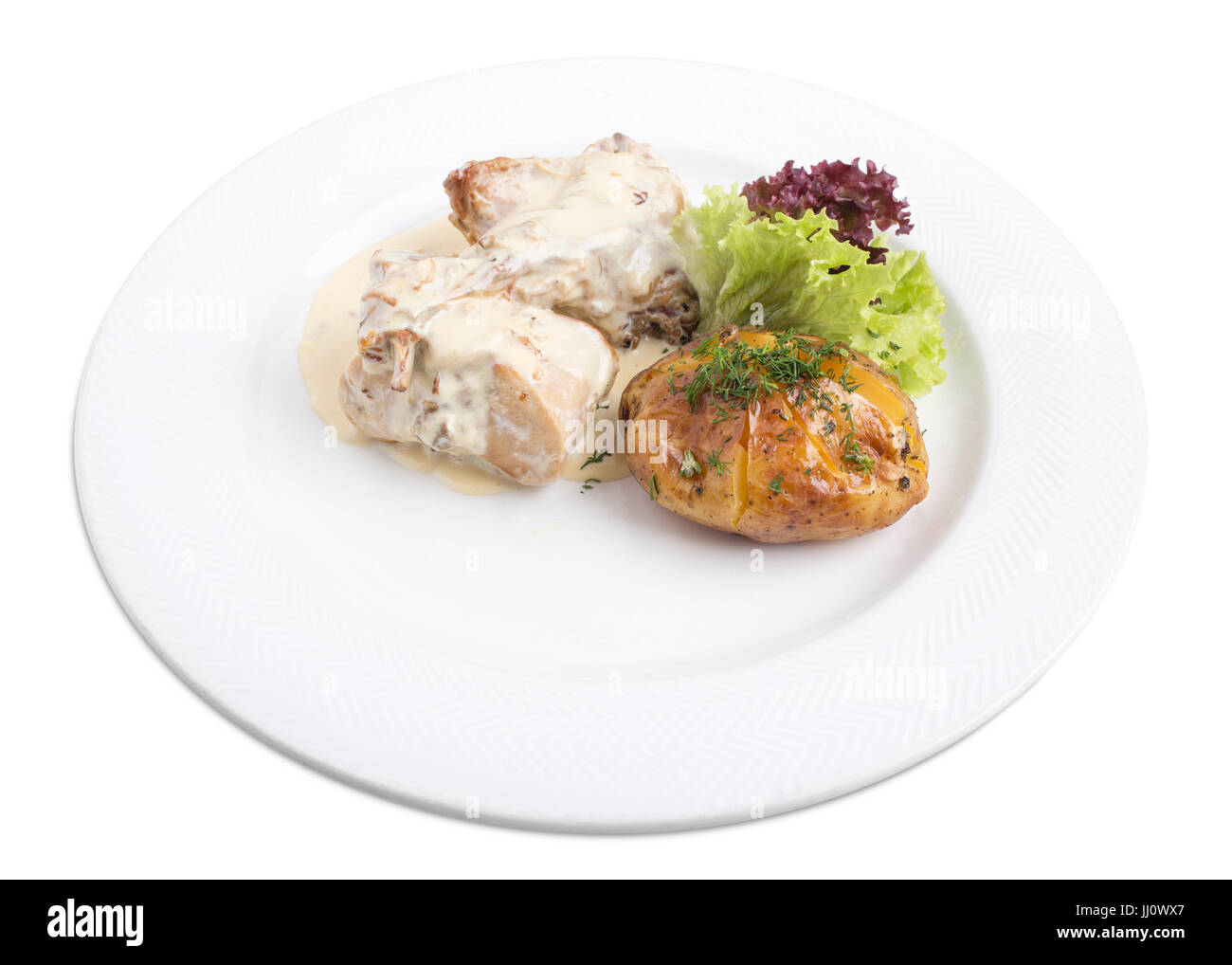 rabbit in white sause with baked potato. Isolated on a white background ...