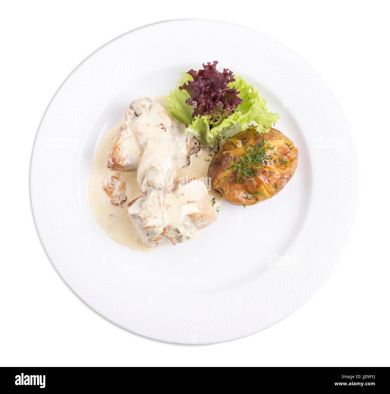 Rabbit in white sause with baked potato. Isolated on a white background ...