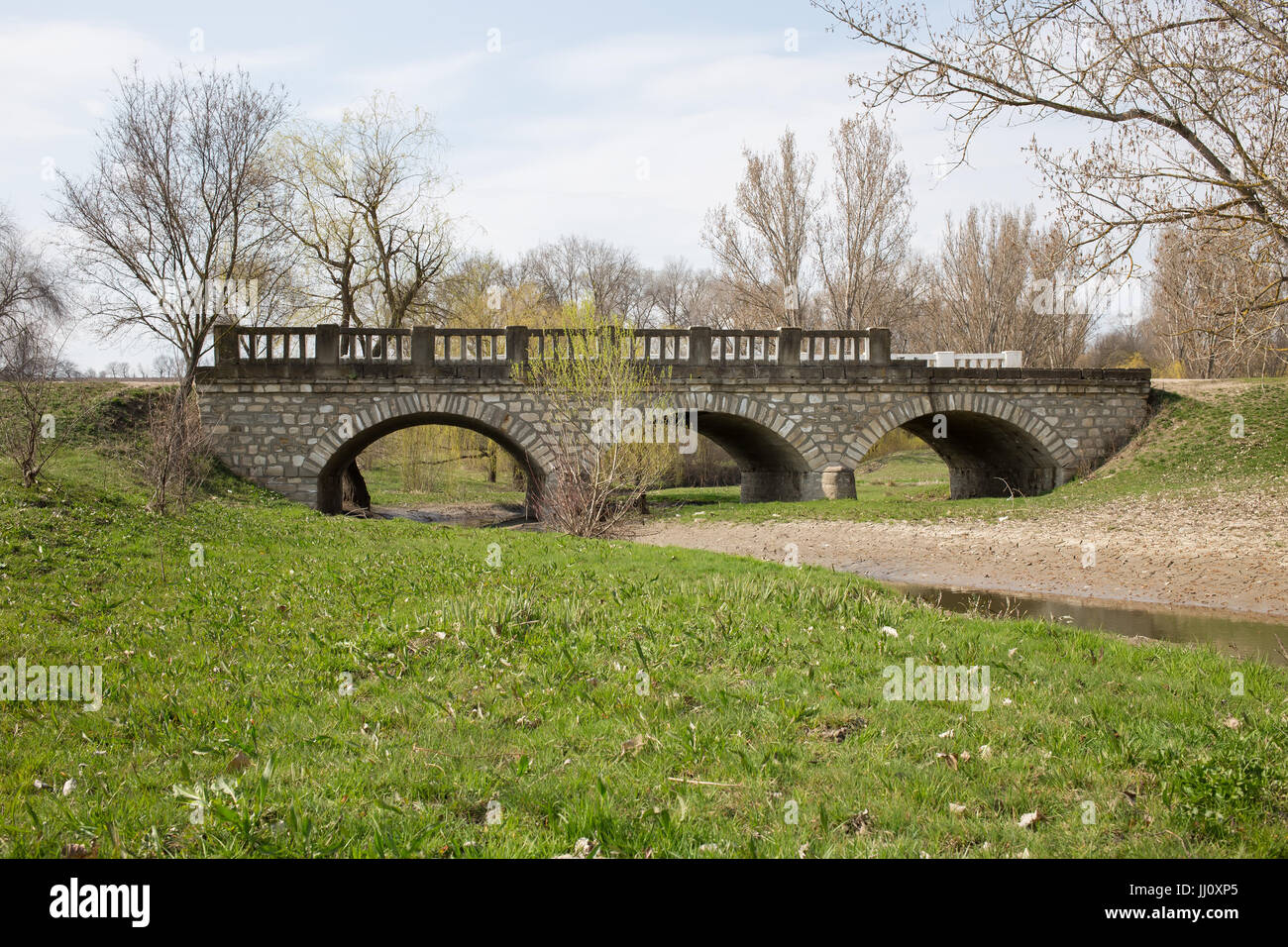 Old broken stone bridge Stock Photo - Alamy