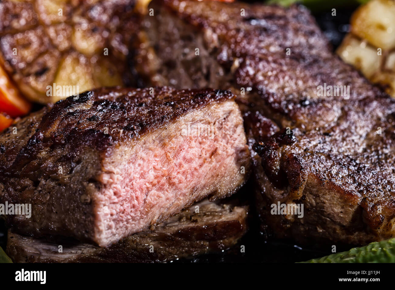Fragment of juicy roasted steak with blood. The concept of natural food ...
