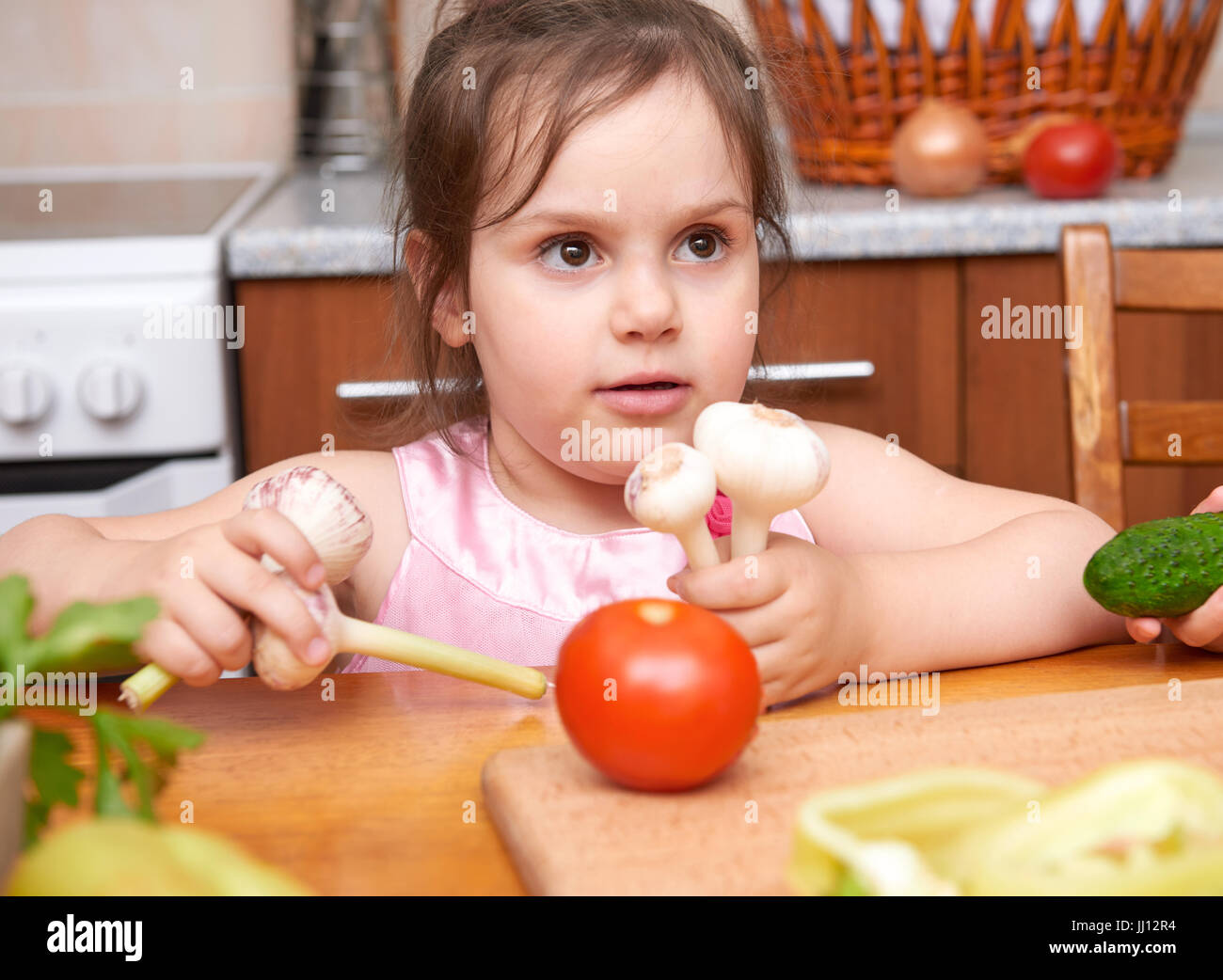 Children at the table with with fresh fruits and vegetables, home ...