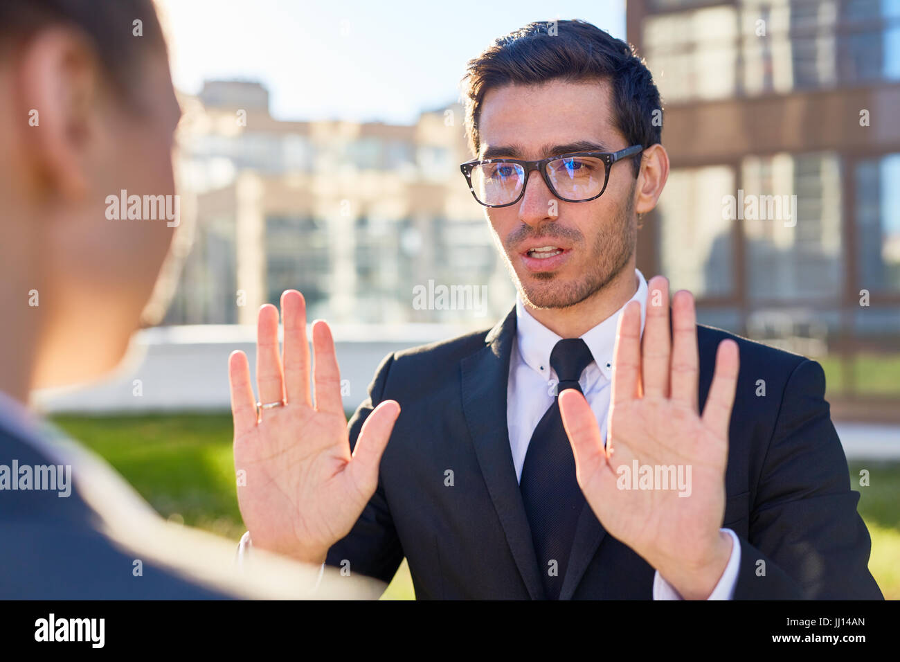 Talking to co-worker Stock Photo - Alamy