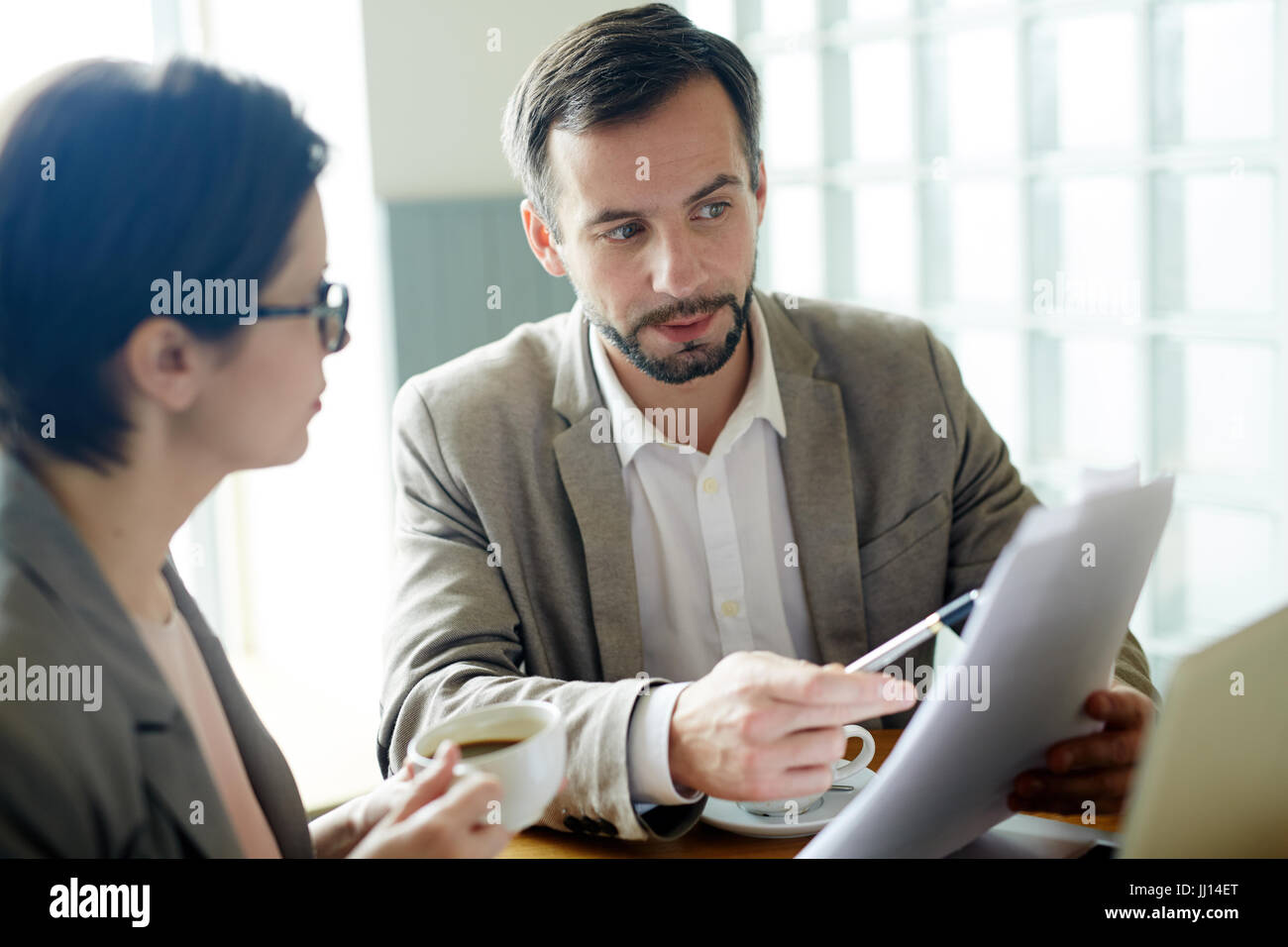 Businessman talking woman negotiating client hi-res stock photography ...