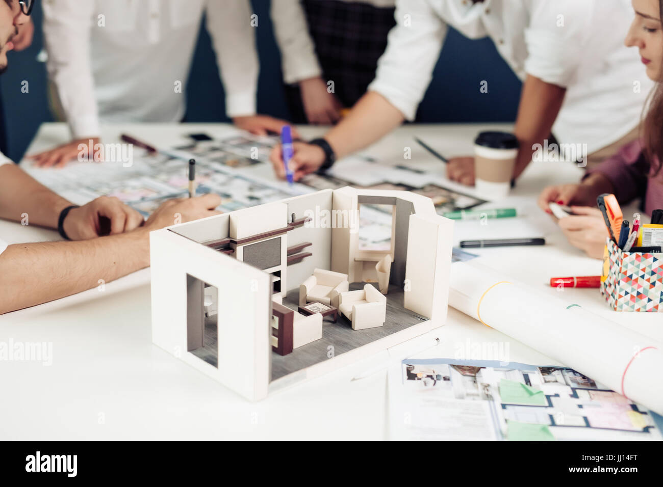 Confident team of engineers working together in a architect studio ...