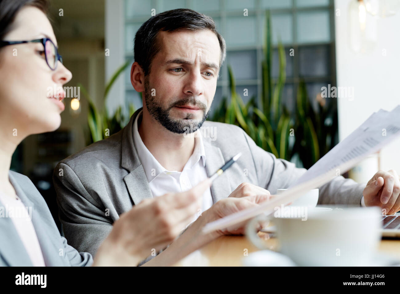 Looking through contract Stock Photo - Alamy