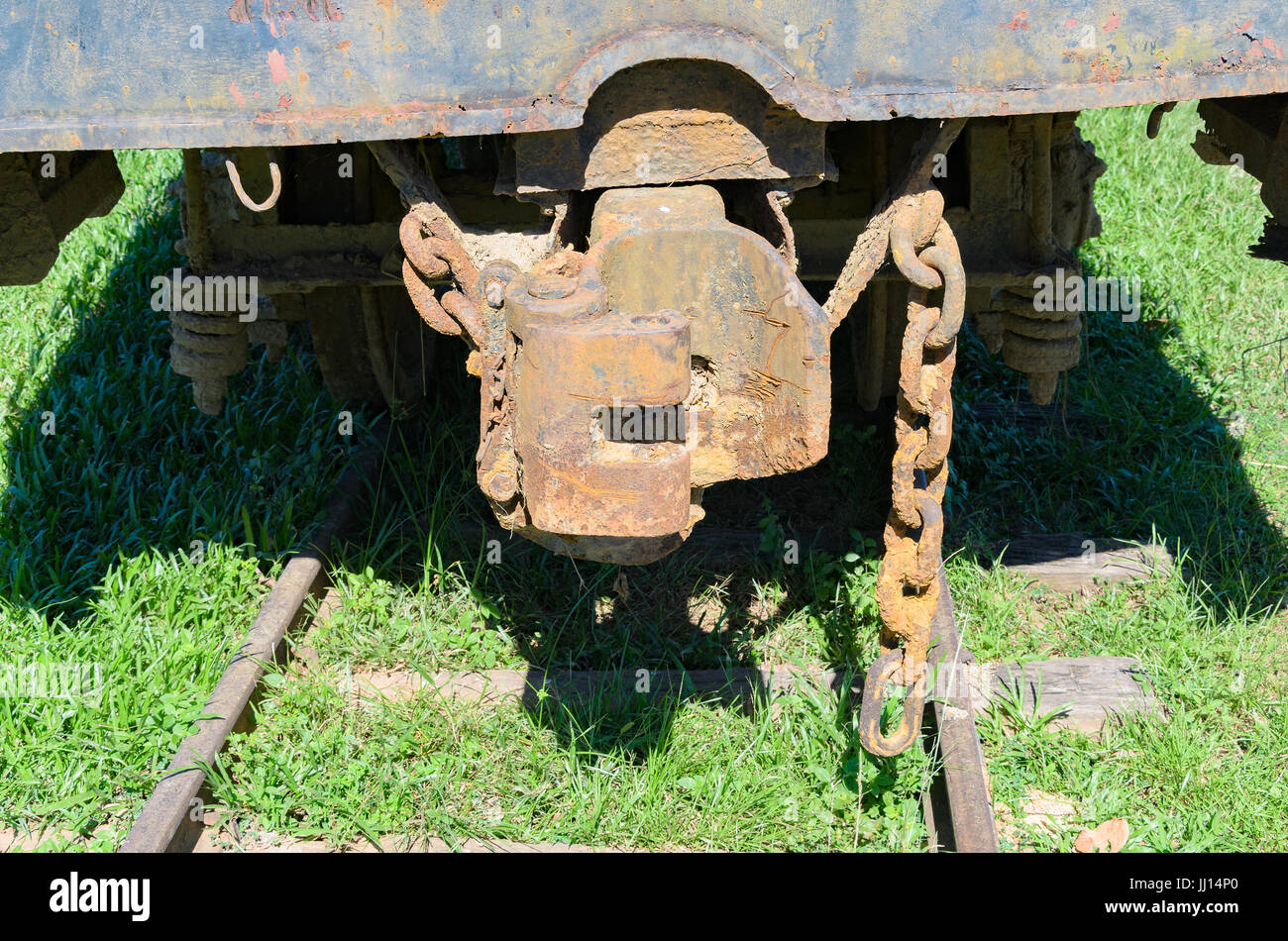 Rusted train hitch and chains over rail of a abandoned train Stock ...