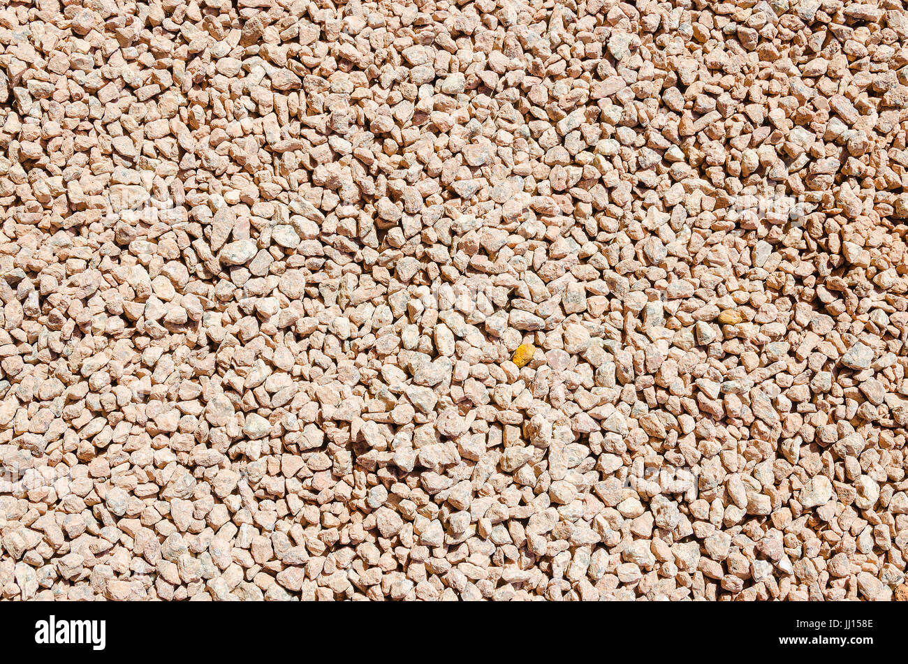 Small pieces of rocks on the ground. Rocks light red Stock Photo - Alamy
