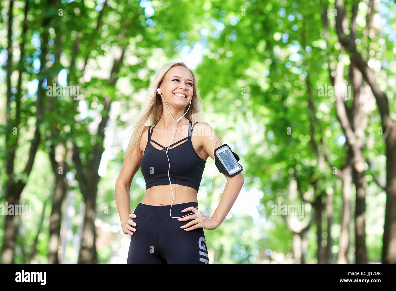 Girl runner blonde portrait in the park Stock Photo - Alamy