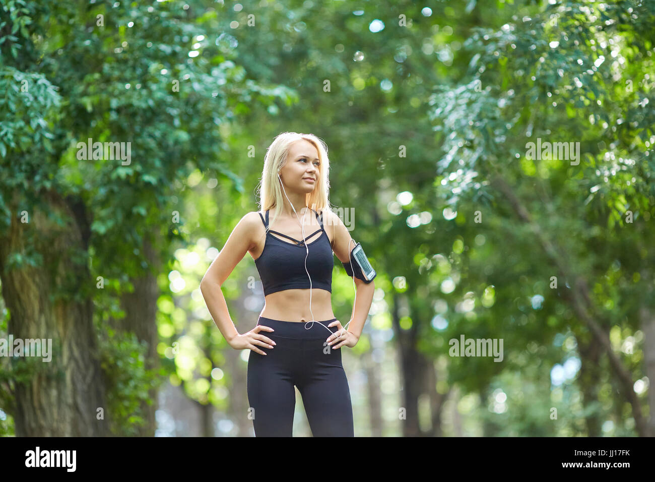 Girl runner blonde portrait in the park Stock Photo - Alamy