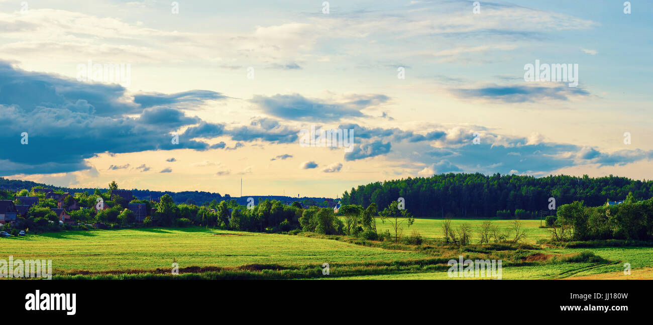 Sunset in the countryside. Rural landscape. Evening sunset sky with ...