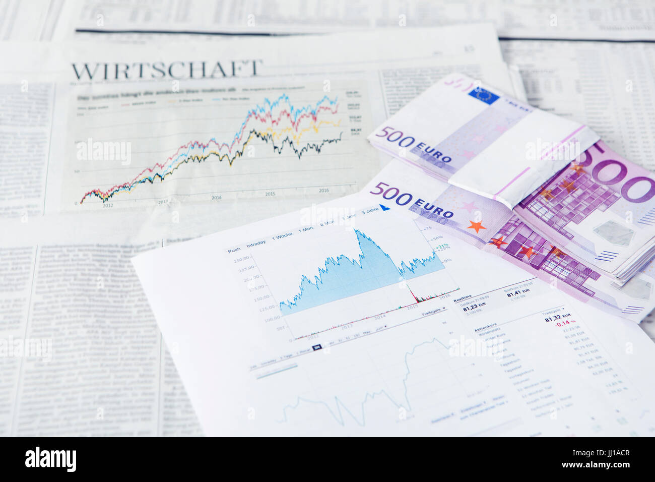 Economic reports and tables in a newspaper with euro money Stock Photo ...