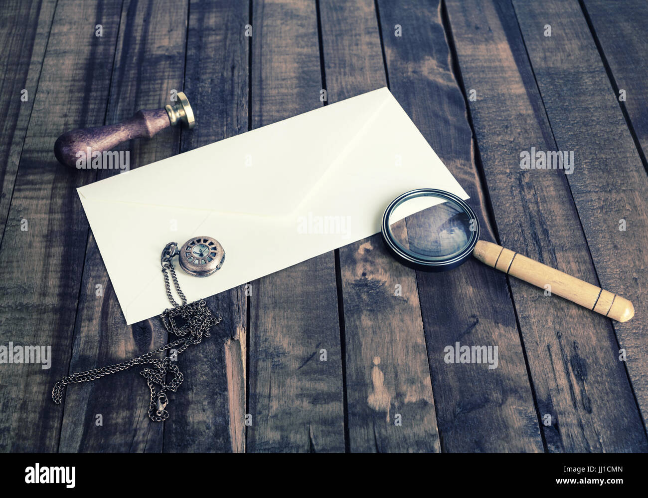 Vintage stationery set. Photo of blank envelope, magnifier, stamp and ...