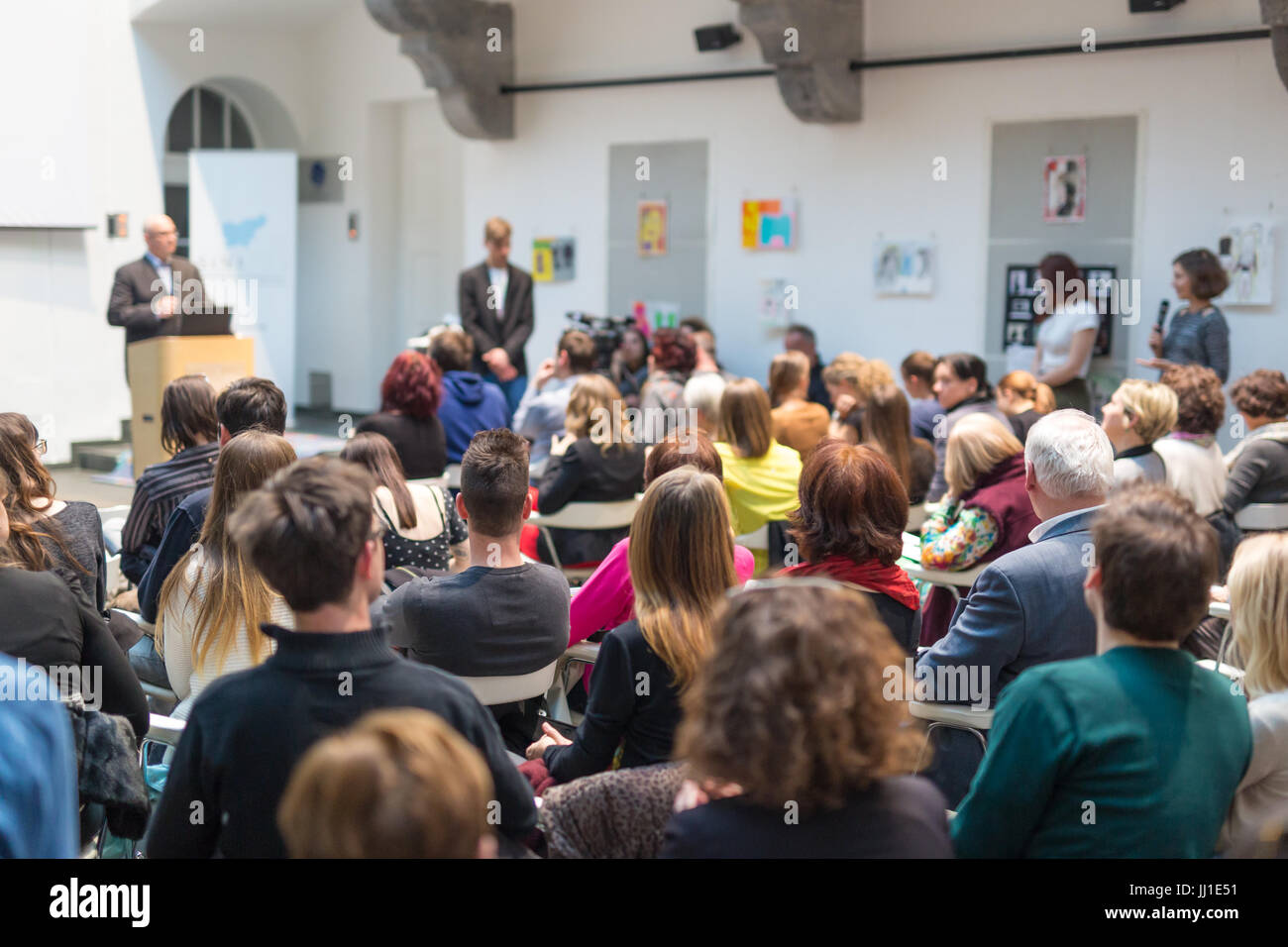 Man giving presentation in lecture hall at university Stock Photo - Alamy