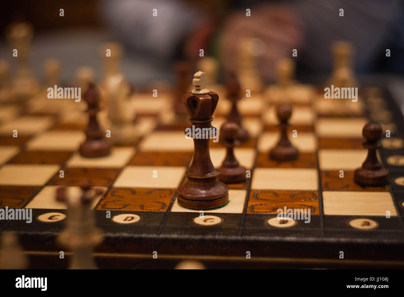 wood chess pieces on board game. vintage background Stock Photo - Alamy