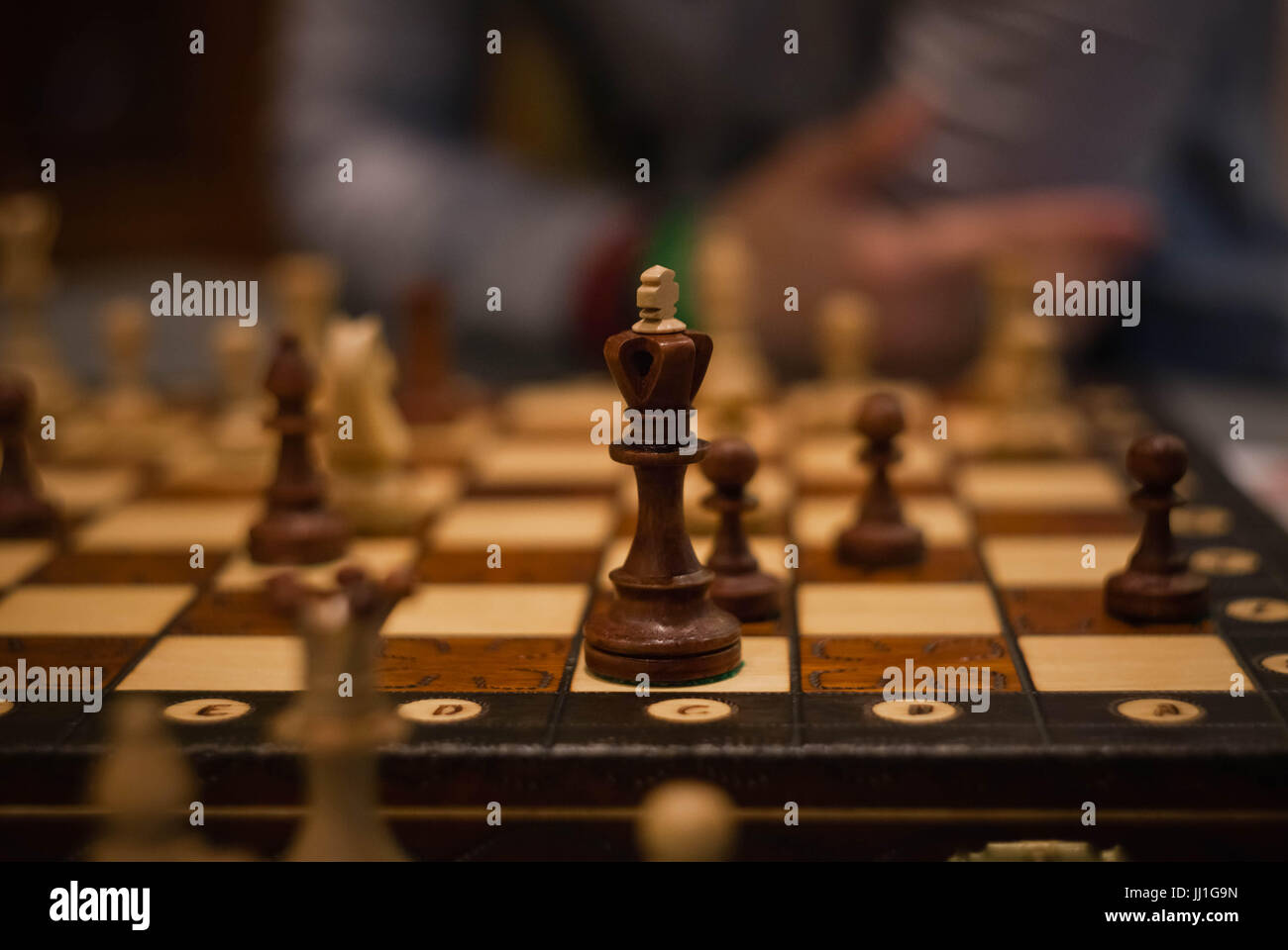 wood chess pieces on board game. vintage background Stock Photo - Alamy