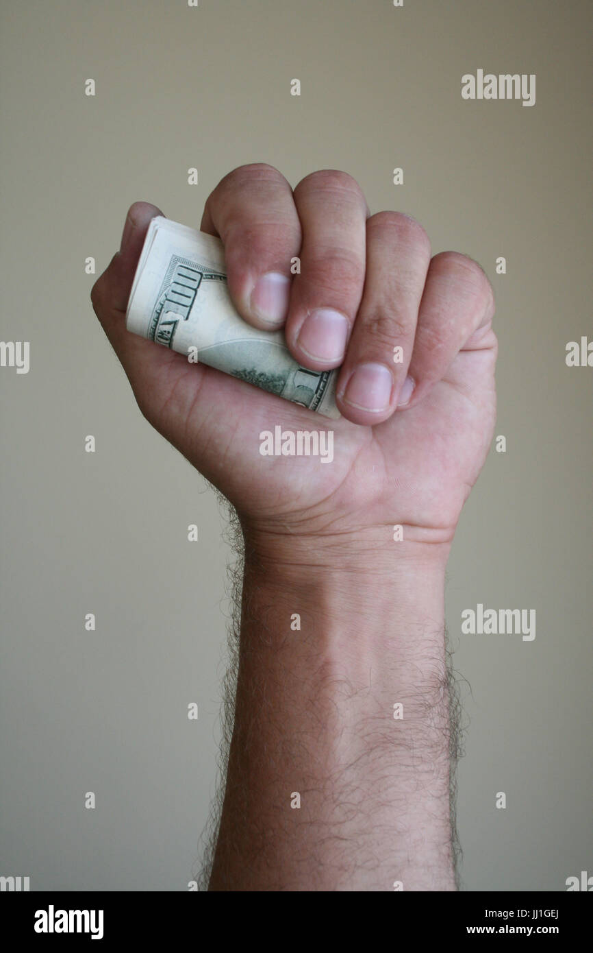 Hand holding note of 100 dollars, São Paulo, Brazil Stock Photo - Alamy