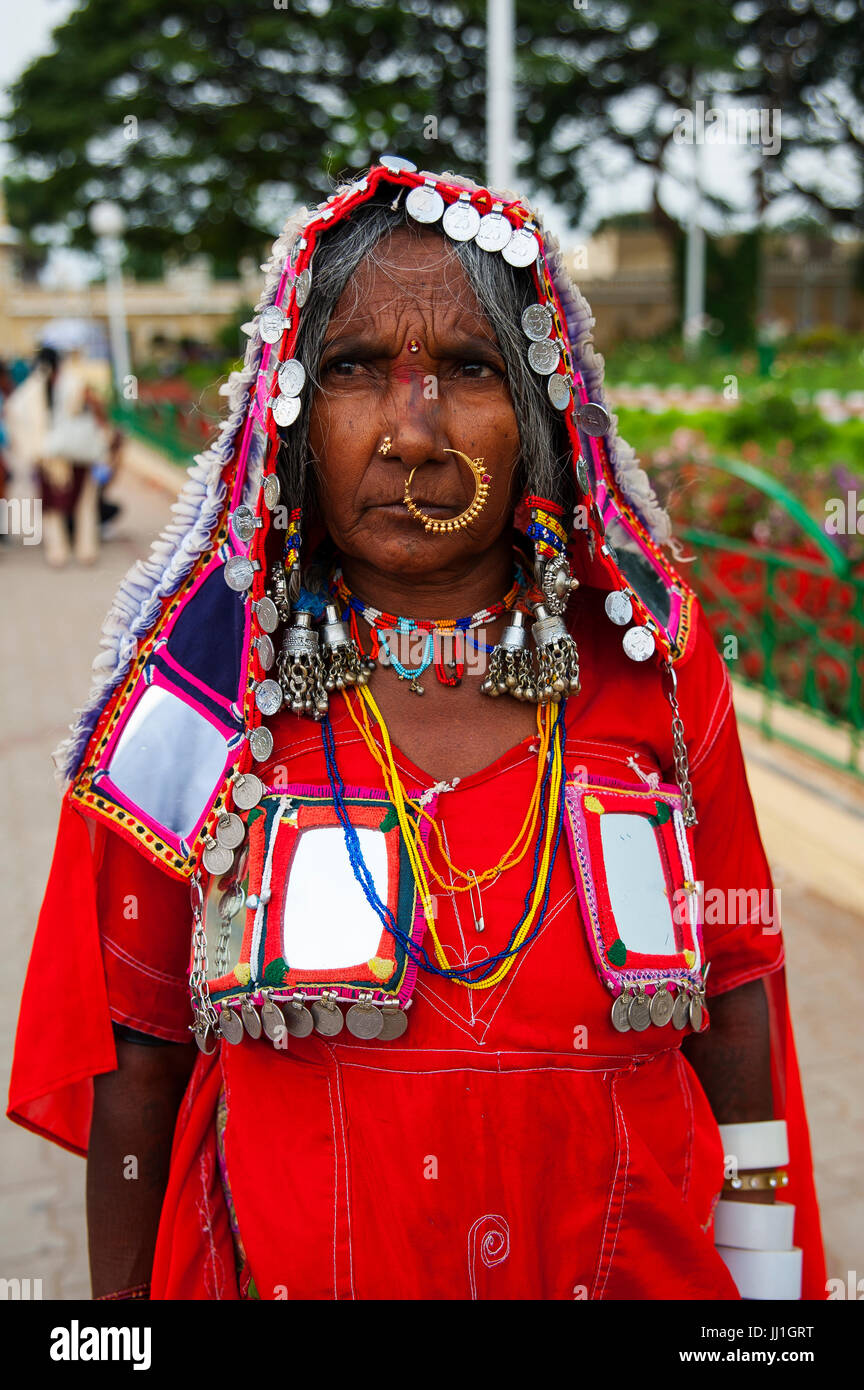 Indian woman in traditional clothes visiting Mysore Palace on a sunday ...
