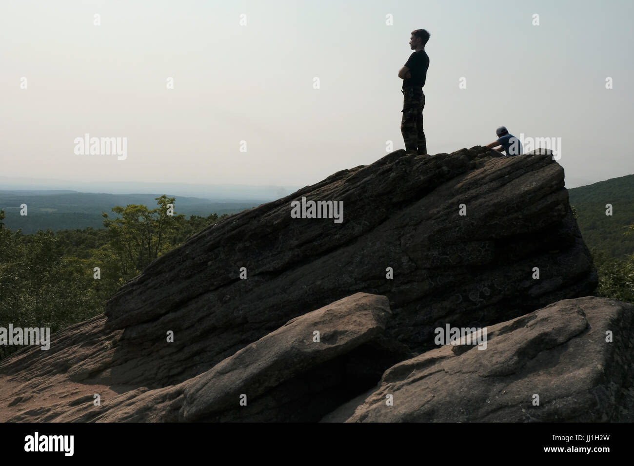 Russian hikers on top of Lyagushka (Frog) rock outcrop a unique rock ...