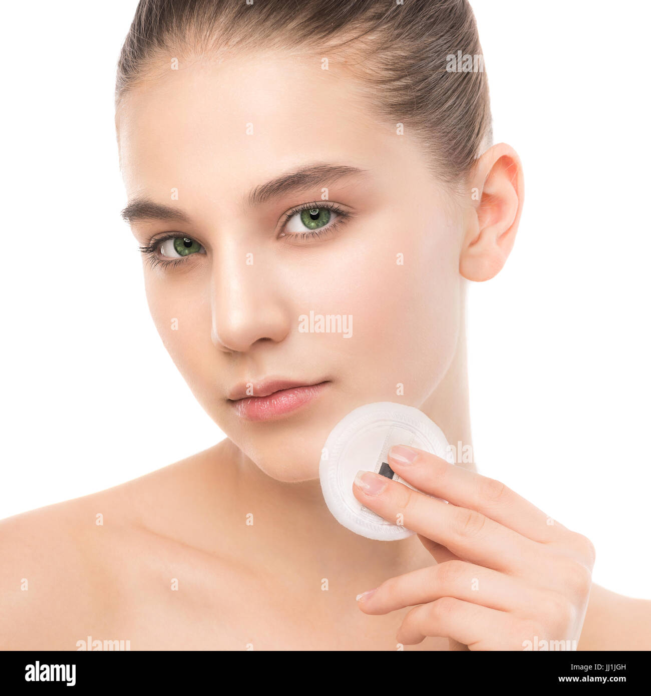 Young woman cares for face skin. Cleaning perfect fresh skin using ...