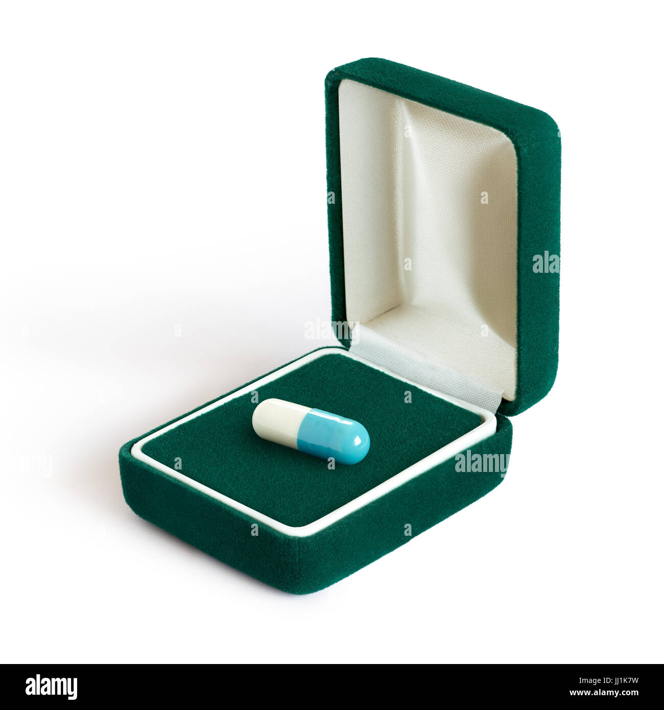 Creative concept photo of a jewellery box with a pill on white ...