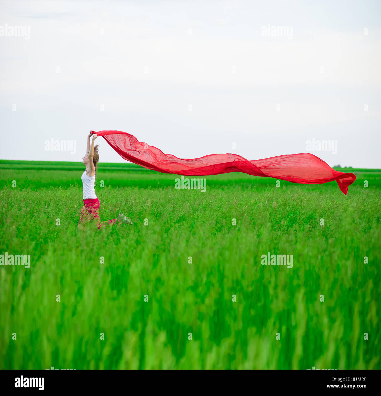 Red silk scarf blowing in wind hi-res stock photography and images - Alamy