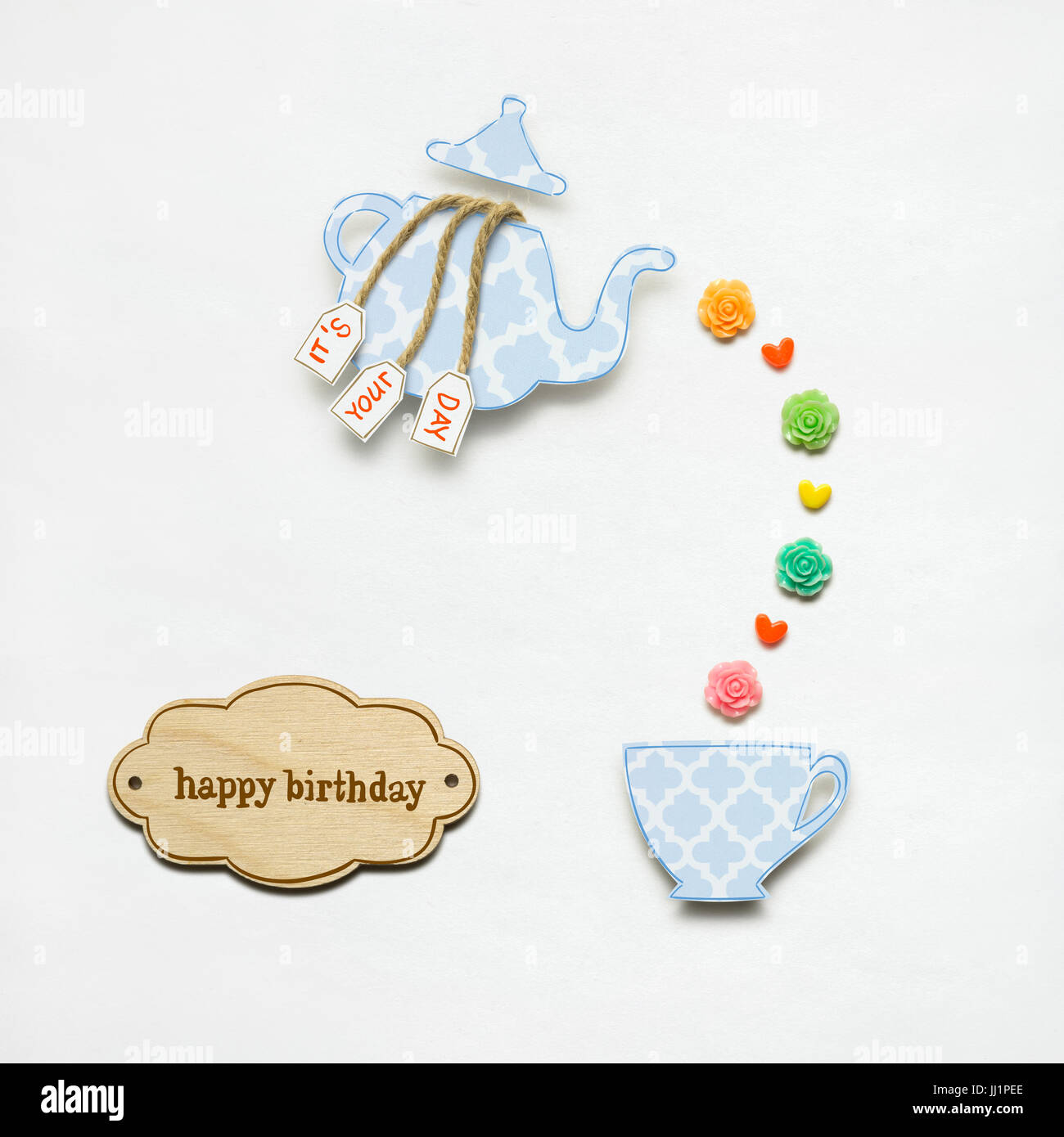 Creative concept photo of a teapot made of paper on white background ...