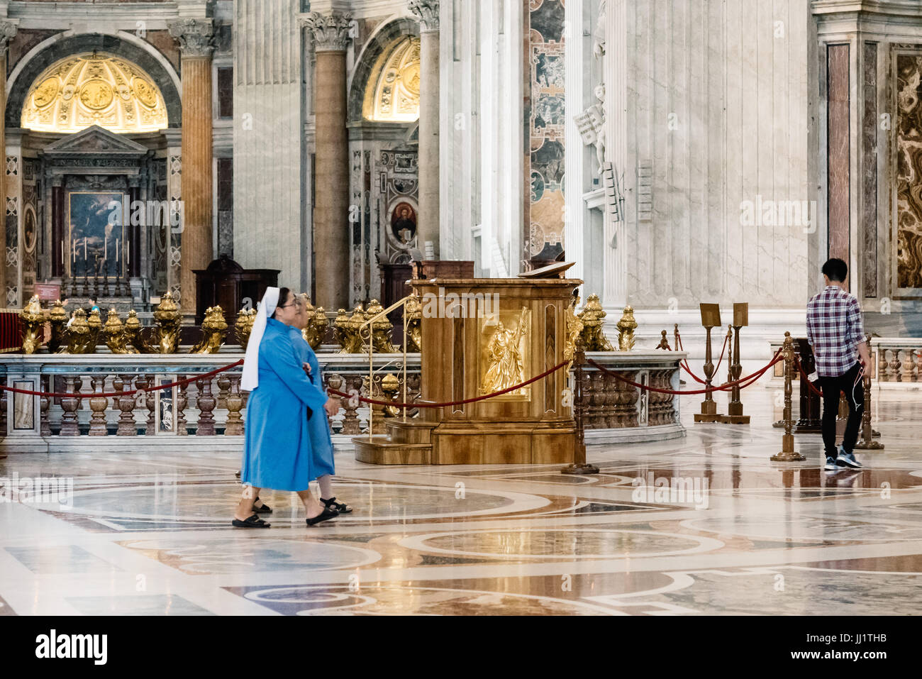 Rome, Italy - August 19, 2016: Nuns in the interior of St Peters ...
