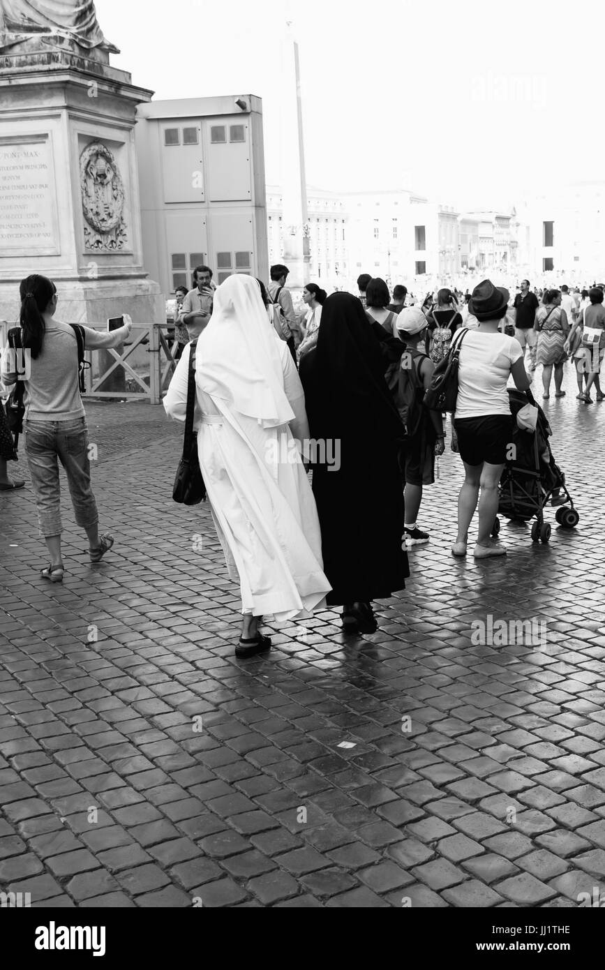 Rome, Italy - August 19, 2016: Two nuns walking on St Peters Square ...