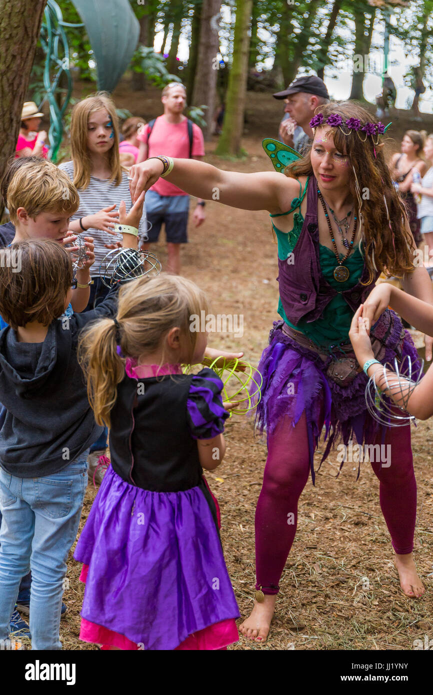 Adult fairy showing children how to use twirling bracelets. Latitude ...