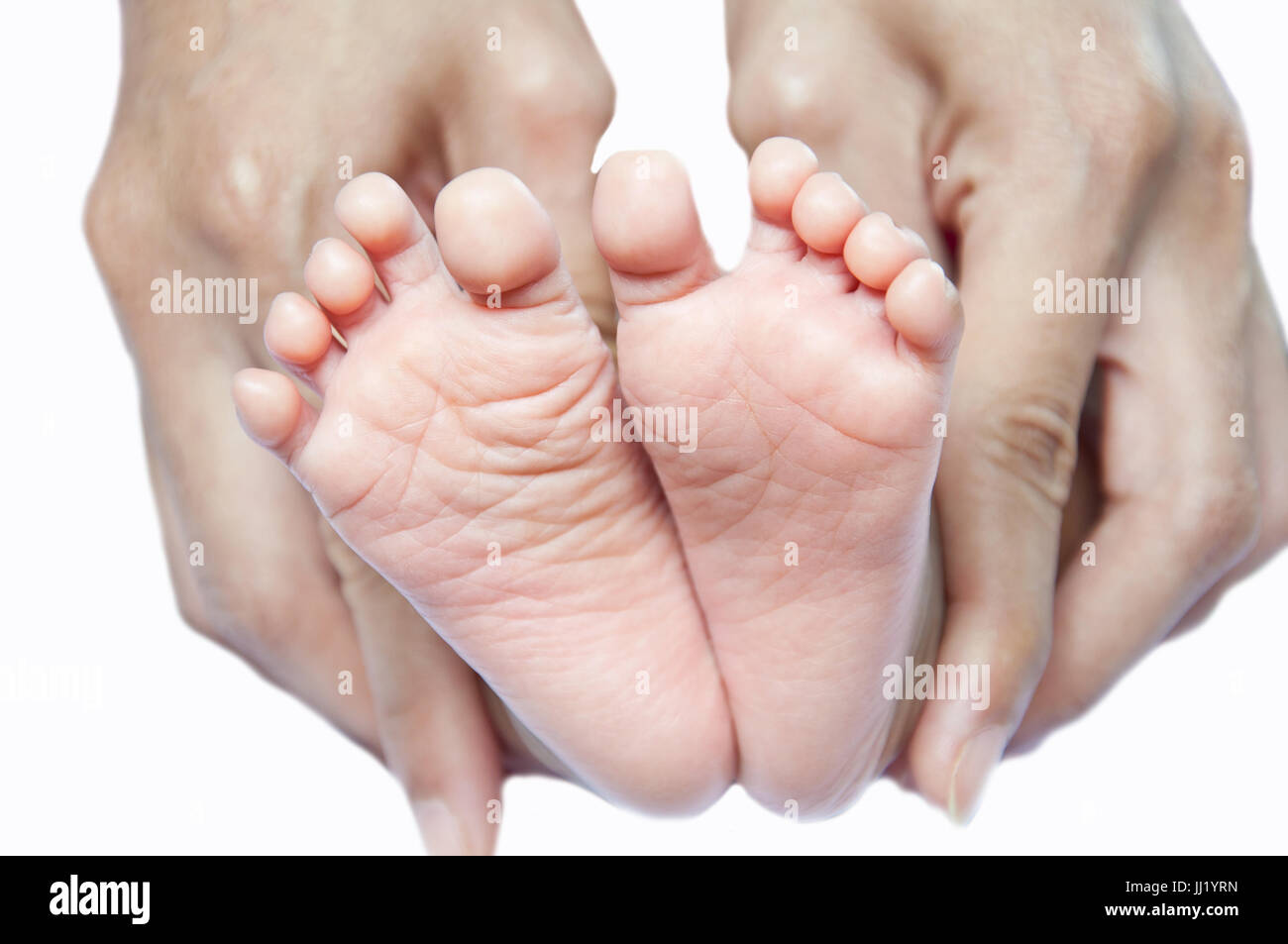 baby foot of new born on white background Stock Photo - Alamy