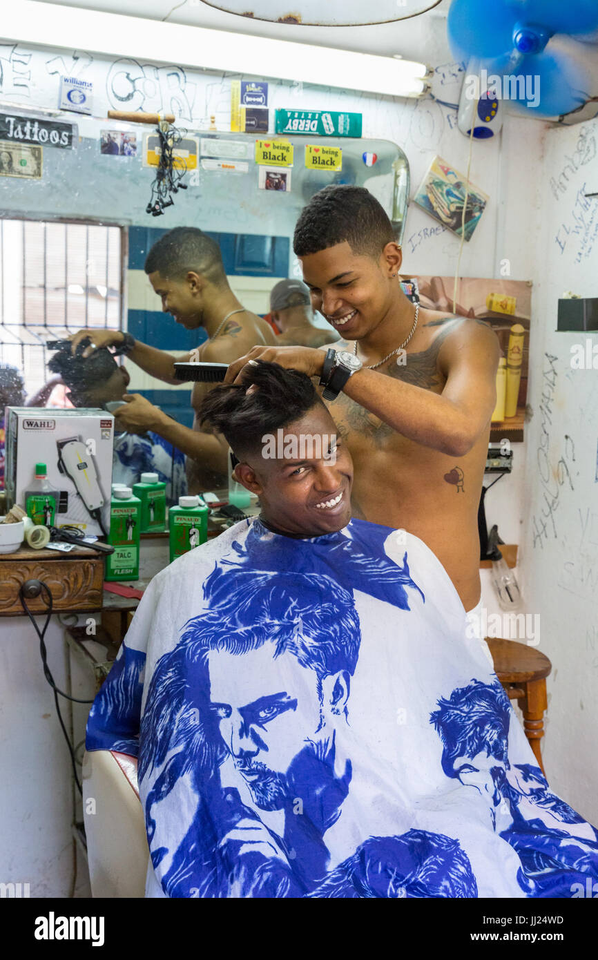 Cuban barber shop, hairdresser cut's a clients hair in Old Havana, Cuba ...