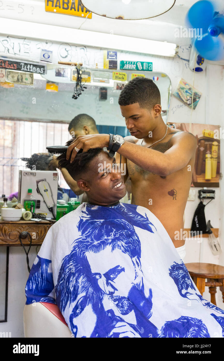 Cuban barber shop, hairdresser cut's a clients hair in Old Havana, Cuba ...