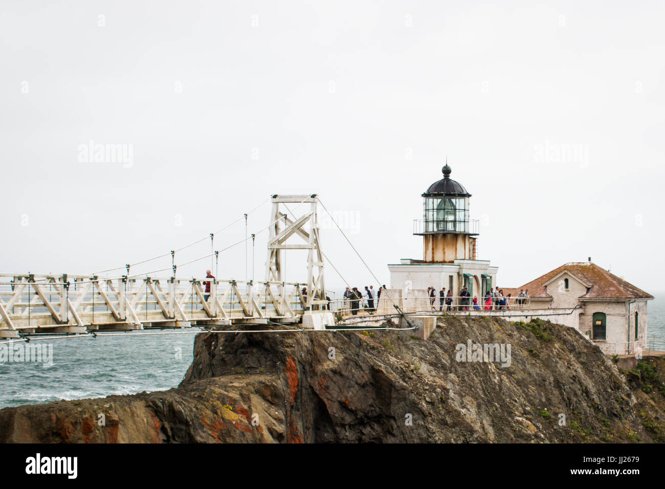 Historic California Point Bonita Lighthouse and suspension bridge on a ...